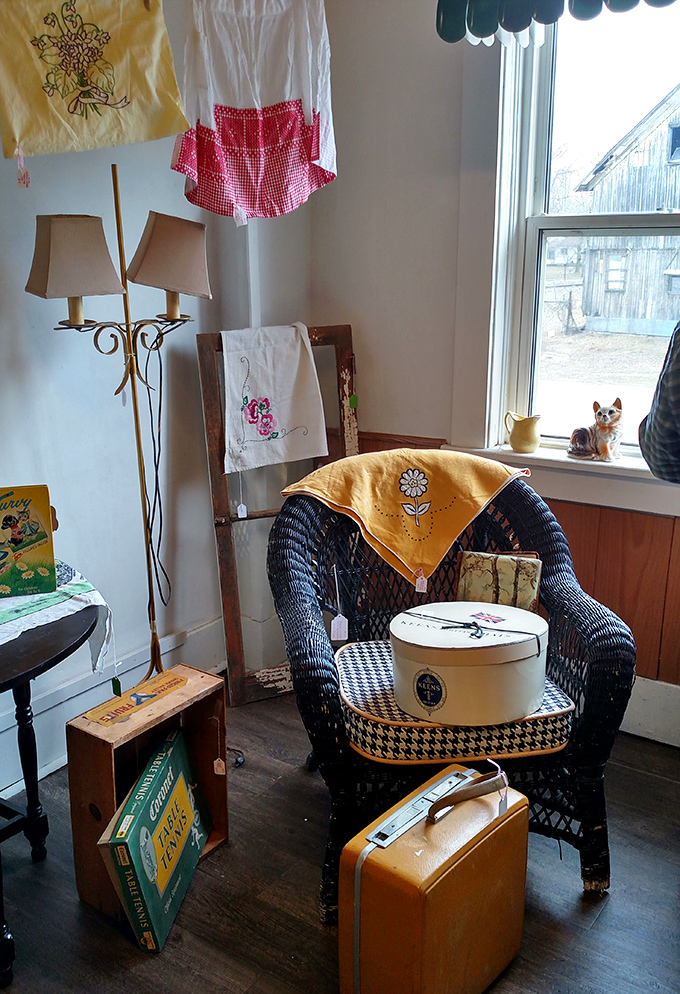 "Take a load off!" This cozy corner is like a time capsule of comfort. From vintage suitcases to retro textiles, it's a traveler's dream.