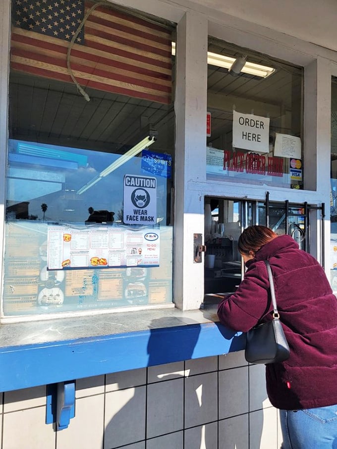 "Order here" - two words that promise a world of deliciousness. It's like the pearly gates, but with more burgers and less judgment.