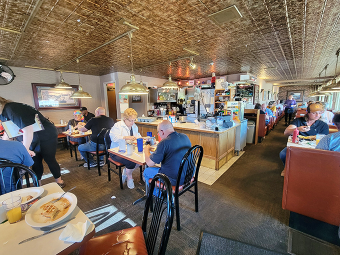 A slice of Americana, served hot and fresh. These diners are living their best breakfast life, one forkful at a time.