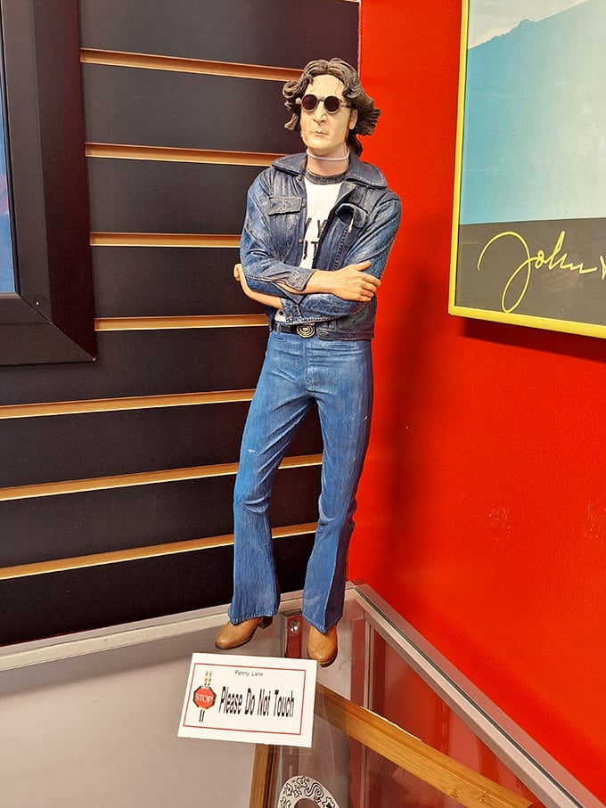 "Please do not touch," says the sign. But oh, how tempting it is to high-five this cool, denim-clad John Lennon figure!