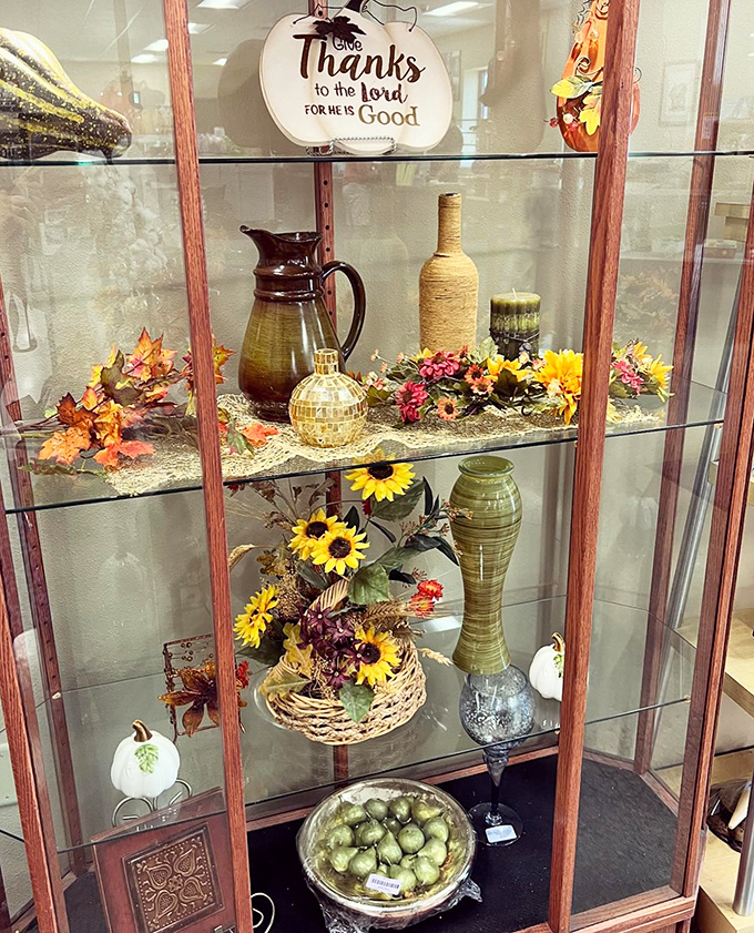 Bringing a touch of autumn indoors! This charming display proves that even artificial flowers can warm up a room with seasonal cheer.