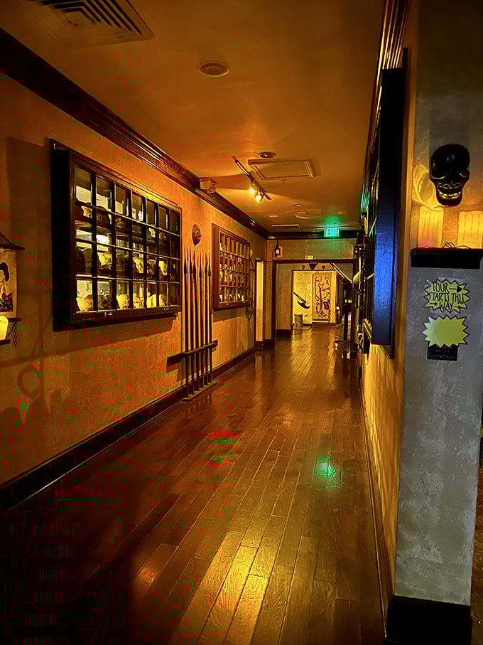 Walk the plank... er, hallway of horrors! This corridor showcases centuries of cruel creativity, illuminated by an eerie glow.