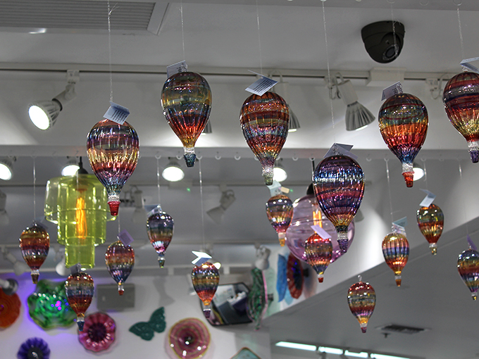 Float like a butterfly, shine like a... glass balloon? These colorful creations add a touch of whimsy to any ceiling.