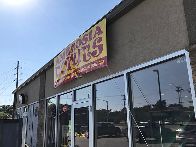 The bat-signal for donut lovers! This sign is a beacon of hope for those in need of a sweet fix and a friendly smile.