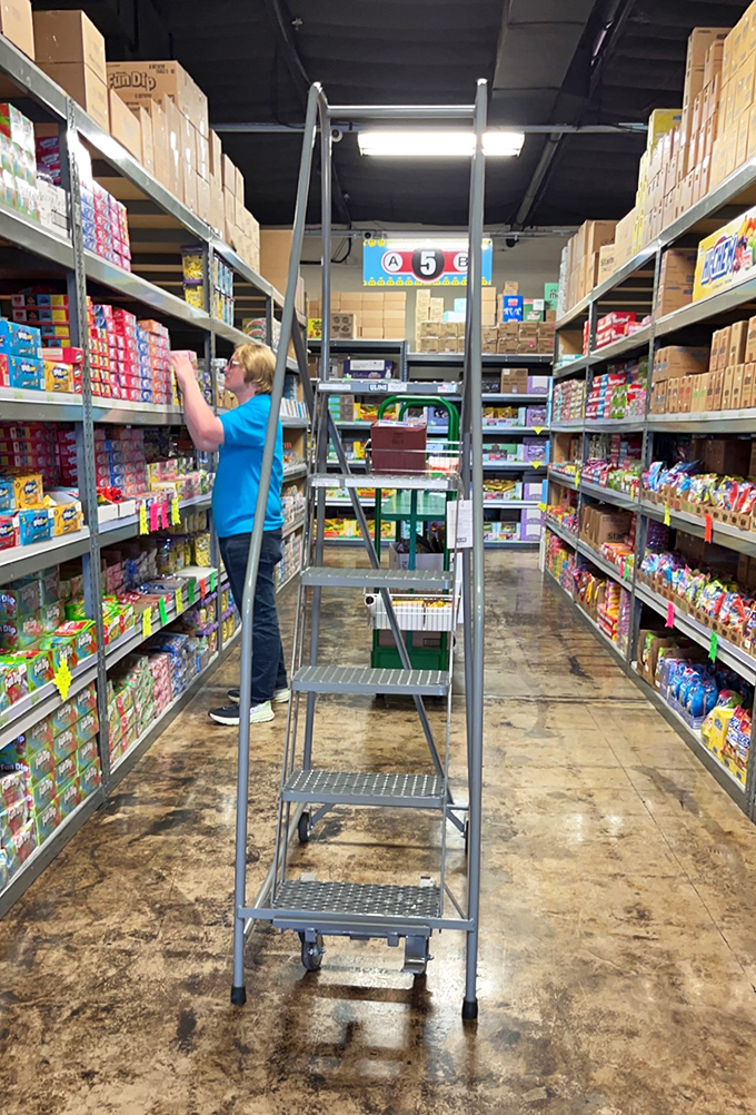 The unsung heroes of the candy world, restocking your childhood memories one shelf at a time. It's like watching Santa's elves in their off-season.