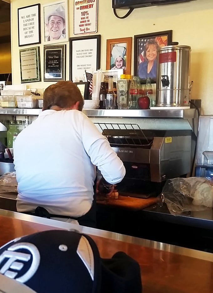 Behind every great diner is a hardworking staff. This kitchen maestro is orchestrating a symphony of sizzles and flips.