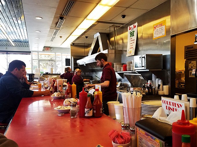 Behind the counter, where the magic happens. These culinary wizards turn simple ingredients into comfort food gold.