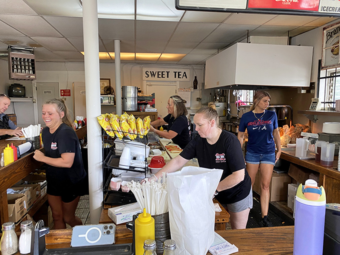 The unsung heroes of hot dog heaven: Brandi's staff, serving up smiles and sustenance with equal gusto.