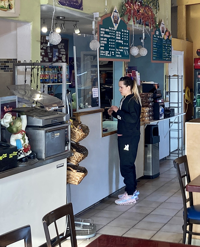 The wizard behind the curtain! This dedicated staff member ensures the magic of fresh donuts never stops.