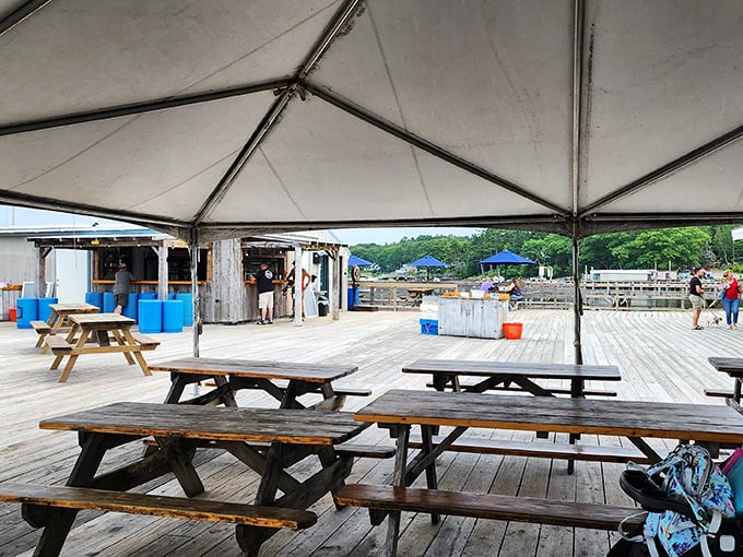 The covered dining area at Muscongus Bay Lobster offers shelter from the elements without separating you from the harbor views.