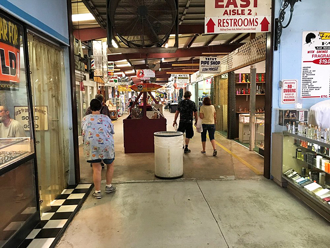 A sea of sunglasses and a mountain of merchandise! This Oldsmar booth is like a department store had a yard sale.