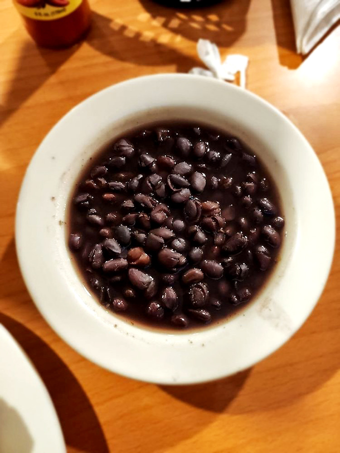 Black beans: The unsung hero of Cuban cuisine. Simple, hearty, and packed with flavor - they're like a warm hug in a bowl.