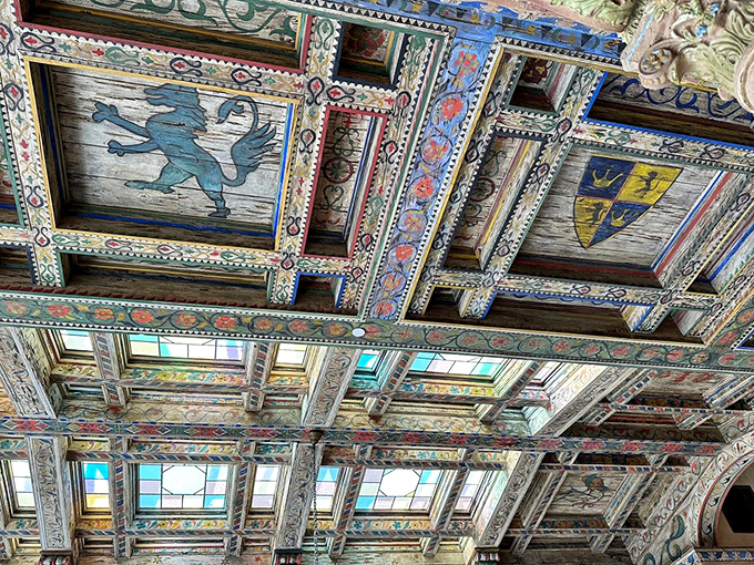 Look up and prepare for your jaw to drop! This ceiling's giving serious "Sistine Chapel meets medieval heraldry" energy.