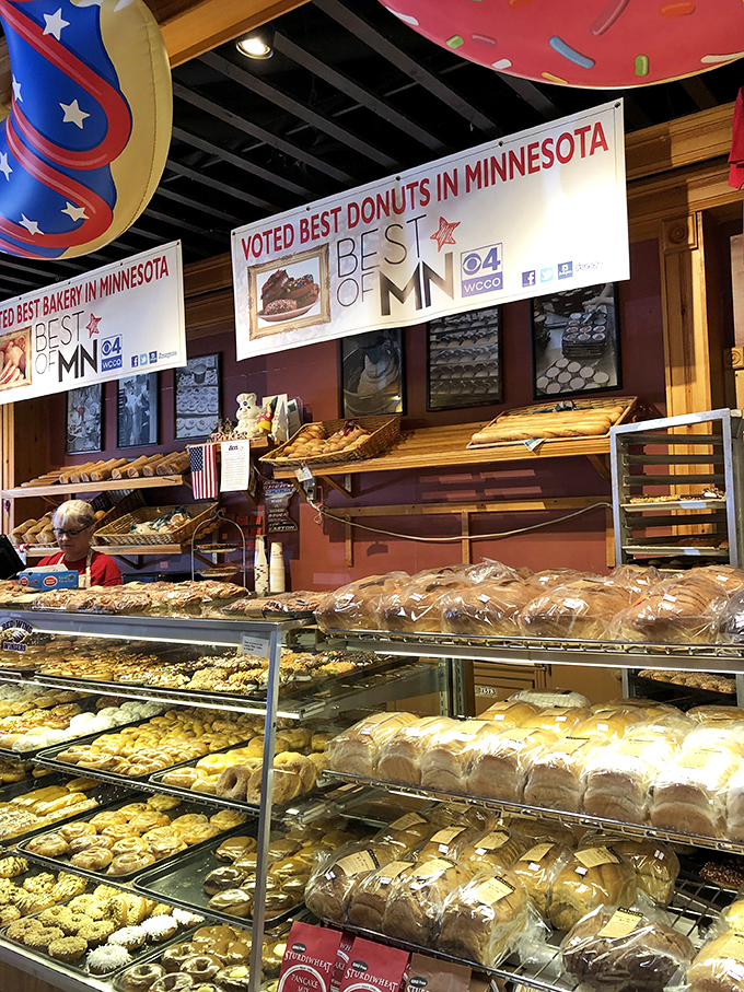 Carb heaven alert! This display case is a gallery of gluten-based masterpieces that would make any diet willpower crumble instantly.