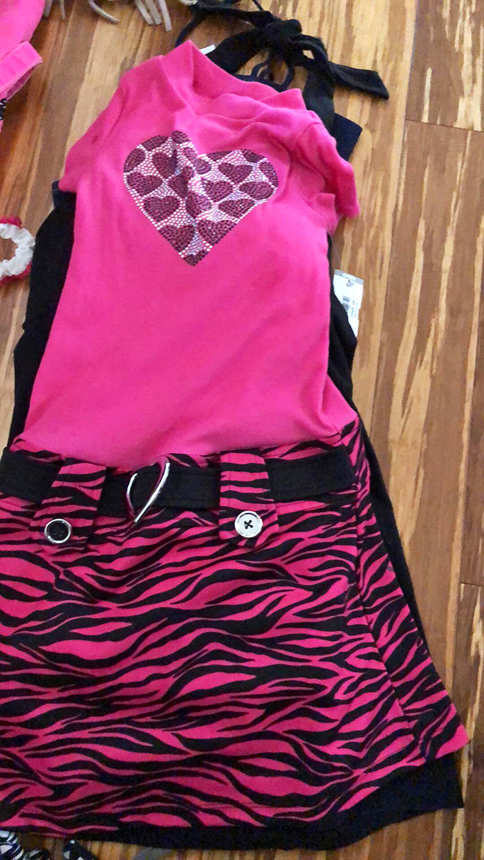 From zebra stripes to sequined hearts, this outfit screams "future fashionista on a budget." Cuteness overload alert!