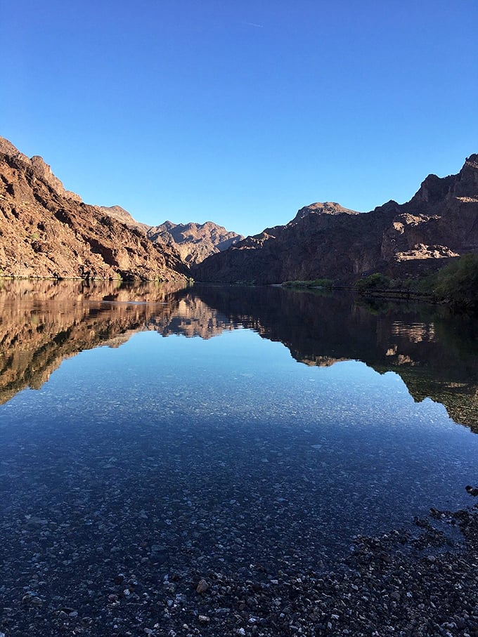 Mirror, mirror, on the lake... This view is so perfect, even the mountains had to do a double-take. Nature's own Rorschach test!