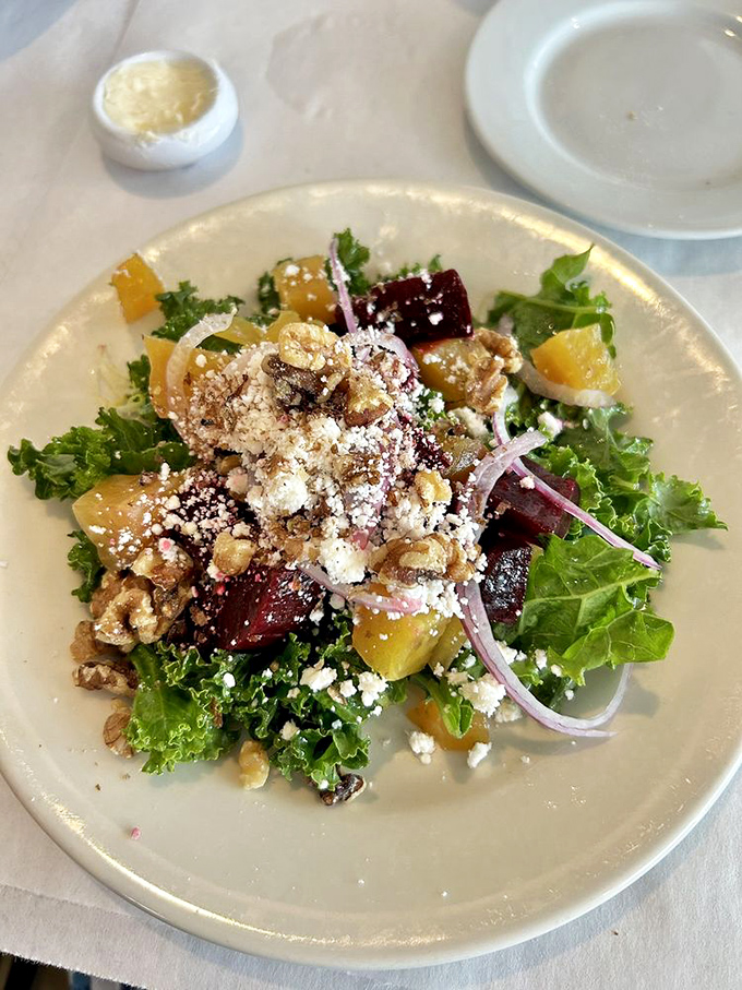 A salad that's anything but boring! This colorful medley of beets and greens is like a farmer's market threw a party on your plate.
