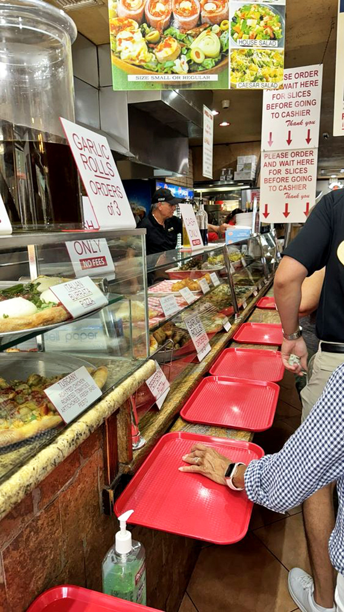 Behind the scenes with the pizza dream team! These folks are the unsung heroes of your flavor adventure.