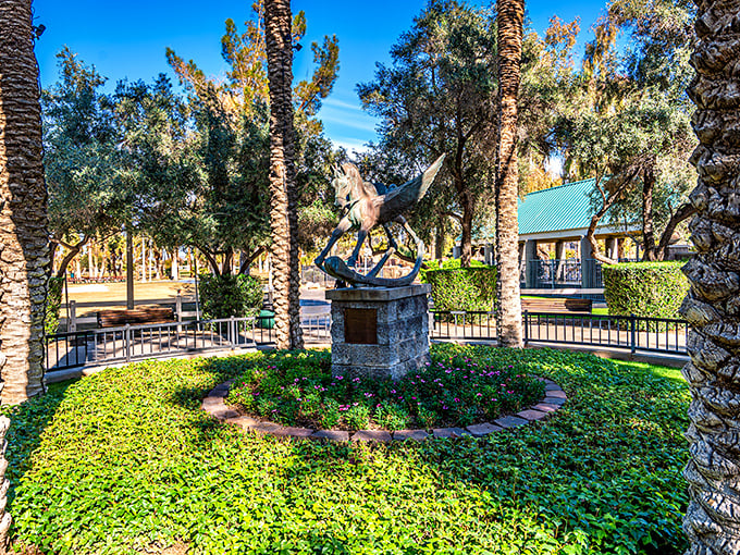 Art meets nature! This statue garden is a serene oasis amidst the cheerful chaos, perfect for contemplating life's big questions... like which ride to hit next.