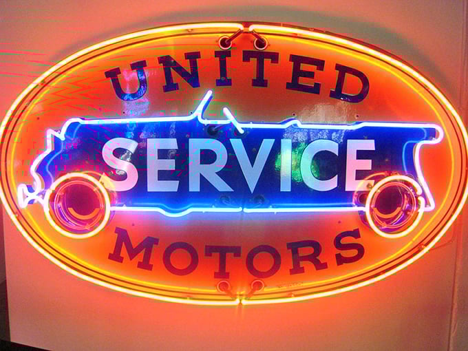 United we stand, in awe of this vintage beauty! This sign revs up memories of classic cars and simpler times.