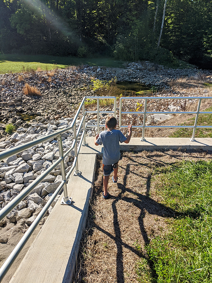 Junior explorer on the case! This young adventurer proves that curiosity and a sturdy railing are all you need for a thrilling expedition.