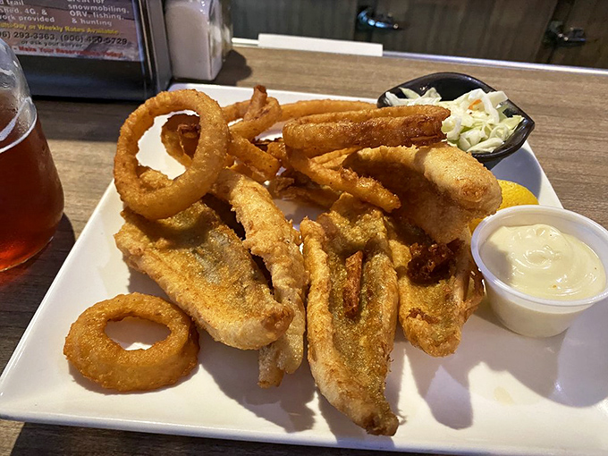 Yellow Belly Perch and onion rings: a dynamic duo that puts Batman and Robin to shame. Lake-to-plate perfection with a crispy twist!