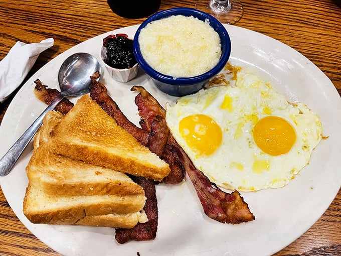 Warning: This plate may induce immediate food coma. But with sunny-side-up eggs and sausages this good, who needs to be productive anyway?