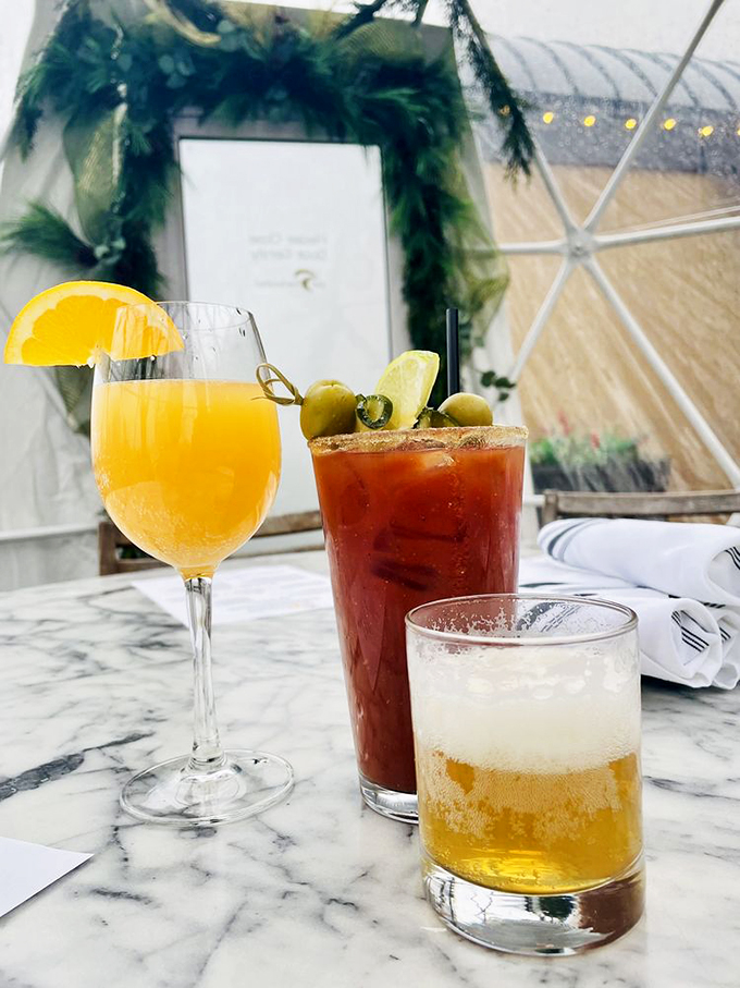 The Holy Trinity of brunch: a Bloody Mary, a mimosa, and something amber. It's like a liquid breakfast of champions, Wisconsin-style.
