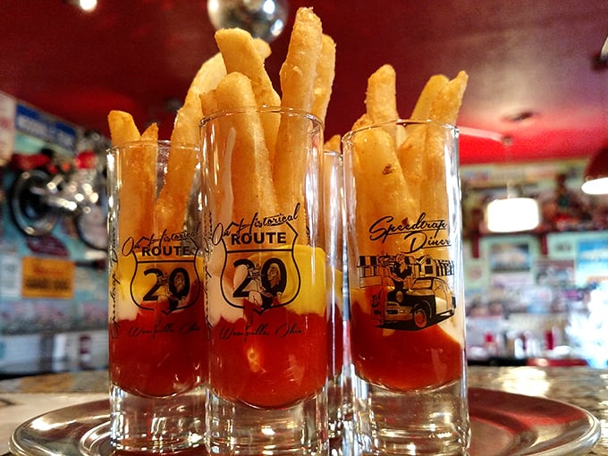 Fry, oh my! These golden sticks of potato perfection are standing tall, ready to dive into a sea of ketchup... or maybe a milkshake?