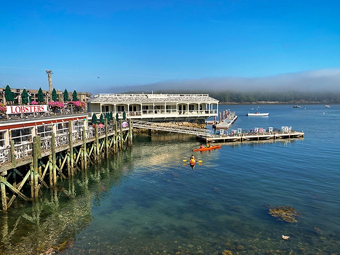 Kayaking in crystal-clear waters? Check. Lobster shacks in the background? Double-check. Living your best New England life? You bet your paddle.