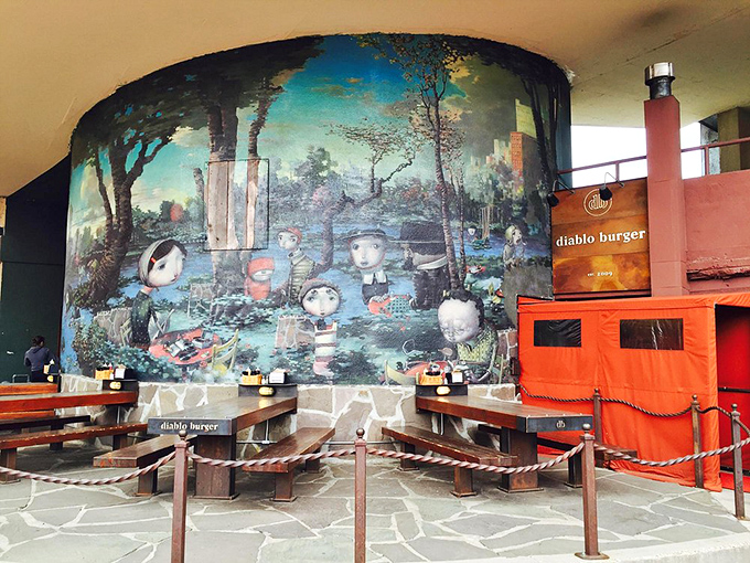 Al fresco feasting at its finest! The outdoor dining area is a whimsical wonderland where burgers and art collide in delicious harmony.