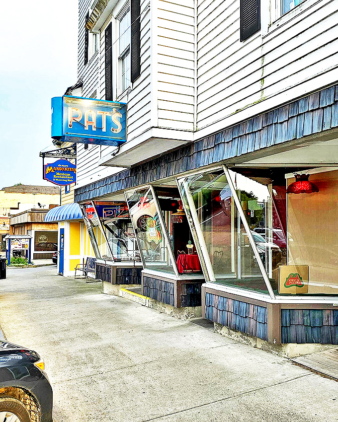 "Pat's: Where pizza pilgrimages begin!" This iconic storefront is like a beacon of deliciousness, guiding hungry souls to pizza paradise.
