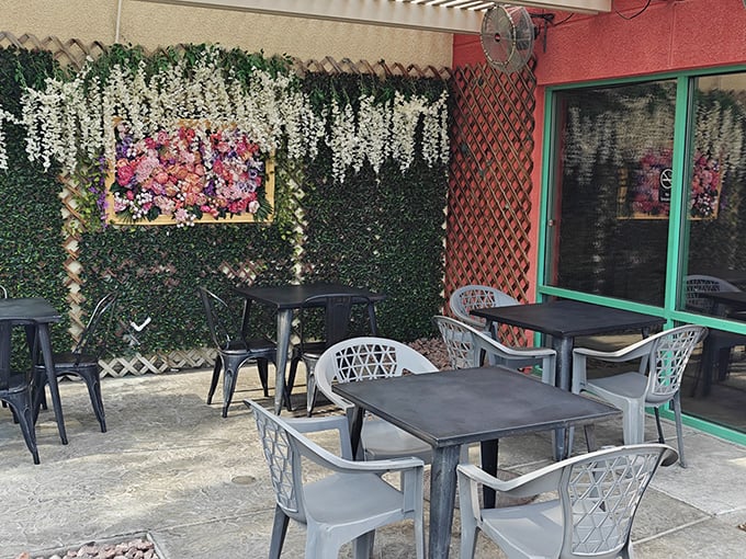 Alfresco dining with a side of flower power! This charming outdoor space is perfect for soaking up some rays while you chow down.