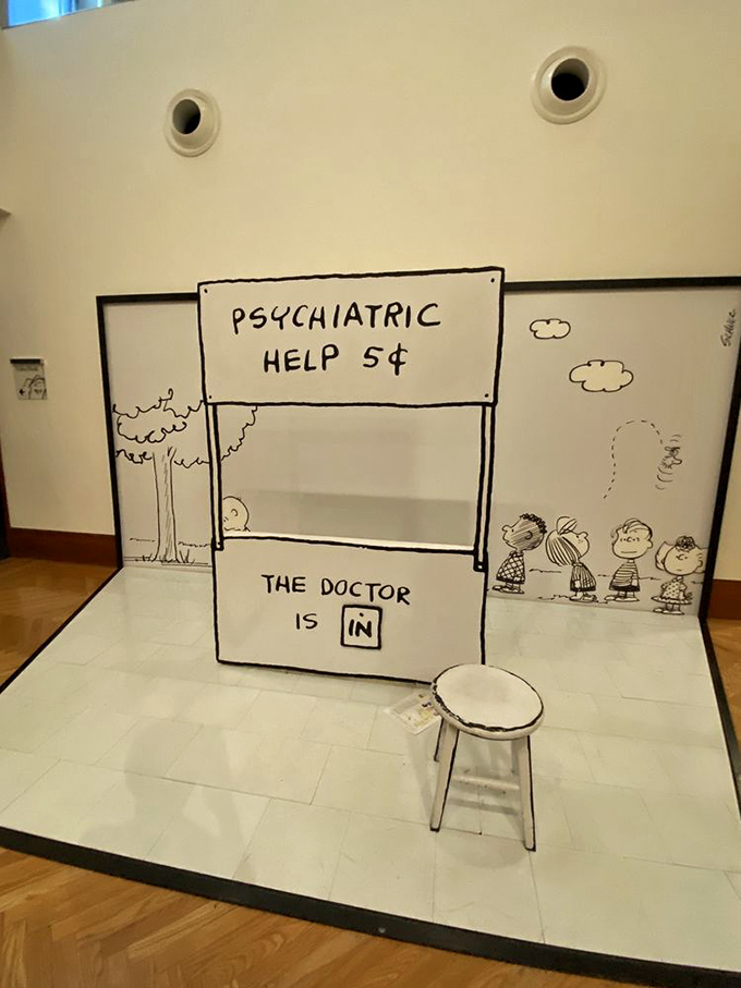 Lucy's psychiatric booth gets a museum makeover. For five cents, you can pretend to solve all of Charlie Brown's problems. Bargain!