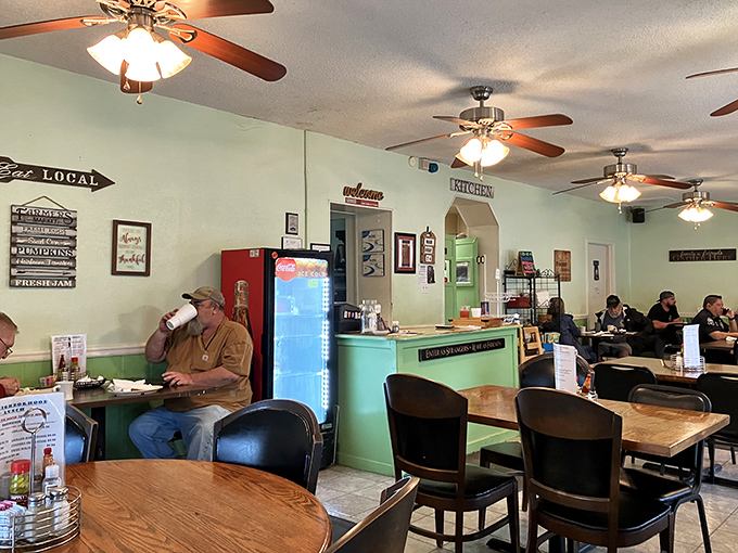 Words to live by! This sign perfectly captures the spirit of The Neighborhood Grill &ndash; where good food turns strangers into friends.