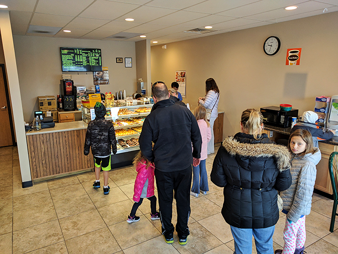 Pilgrims on a quest for the holy grail of pastries. These folks know that patience isn't just a virtue – it's the secret ingredient to scoring the perfect donut.