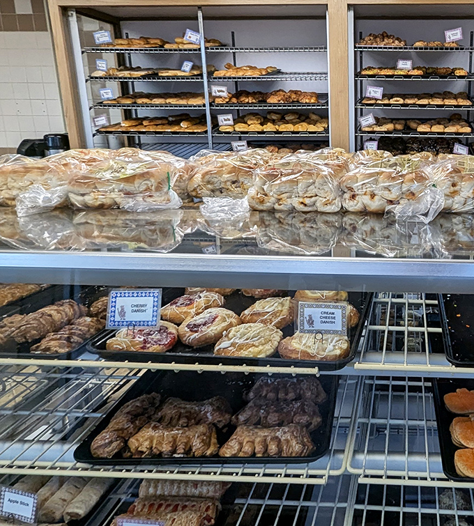 A kaleidoscope of carbs! JR's pastry case is like a treasure chest of deliciousness, each shelf a new adventure in flavor.