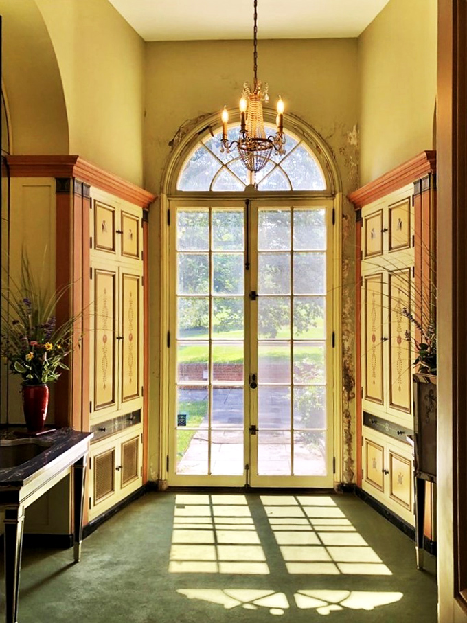 Sunlight paints the floor, creating a daily masterpiece. Van Gogh would be jealous of this door.