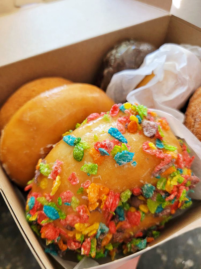 Fruity Pebbles meet donut perfection! It's like your childhood cereal grew up and decided to live its best life.