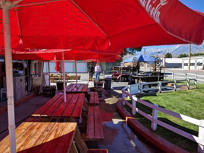 Dine al fresco under a sea of red! These outdoor tables offer the perfect spot for a smoky feast.