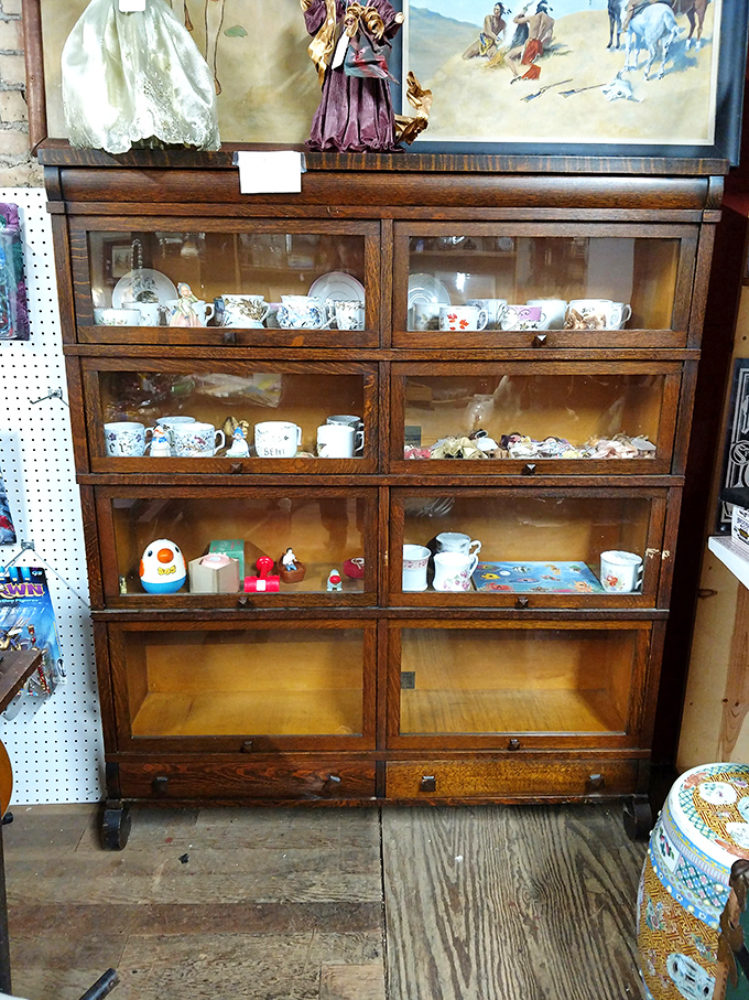 "China cabinet or time capsule?" This elegant display case is serving up a smorgasbord of vintage dinnerware. Tea time, anyone?