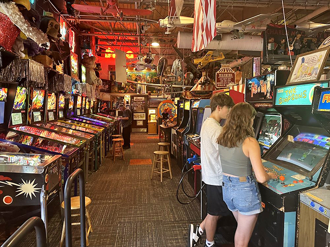 Young love blooms amidst the beeps and boops. It's like a scene from "Stranger Things," but with better hair and fewer demogorgons. Game on, lovebirds!