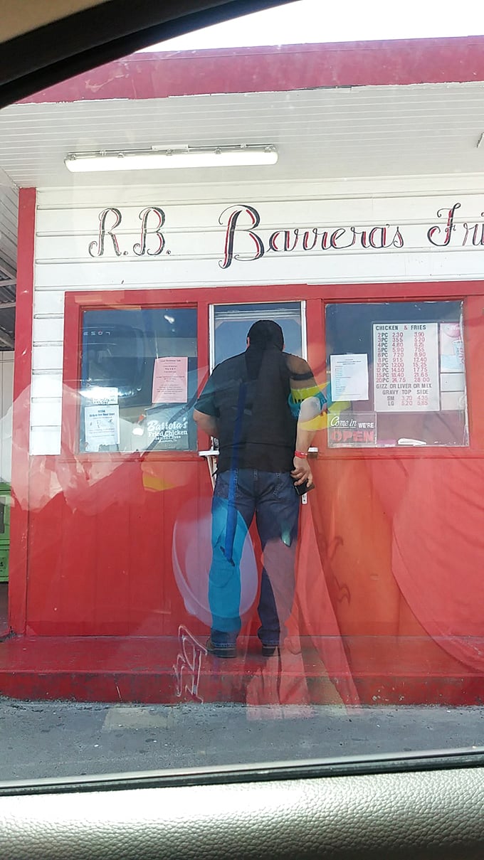 The moment of truth! This customer's anticipation is palpable as they prepare to dive into crispy chicken bliss.