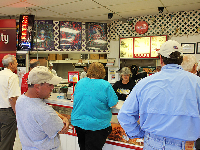 Where everybody knows your glaze! Locals line up for their daily dose of doughy delight, proving community is best served sweet.