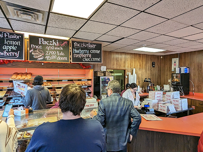 The line between man and donut blurs! These happy customers prove that patience is a virtue, especially when rewarded with fried perfection.