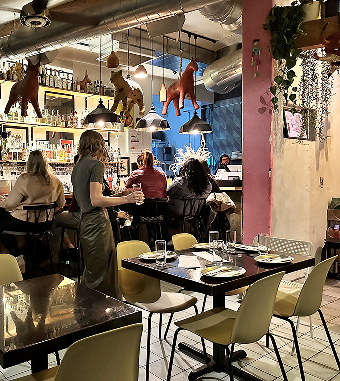 Diners in their natural habitat, surrounded by pi&ntilde;atas. It's like a birthday party, but with better food and fewer screaming kids.