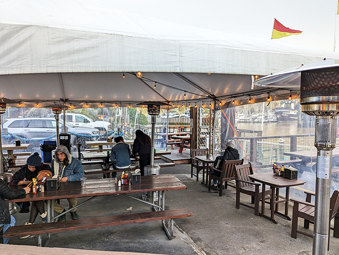 Dinner with a view! These happy diners know the secret to a perfect meal: fresh seafood, good company, and a side of ocean breeze.