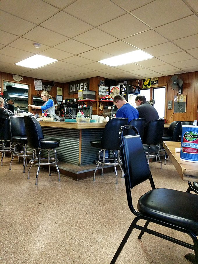 Where everybody knows your name! This bustling counter is the heart of Allen's Corner Diner, serving up community spirit alongside hot coffee.