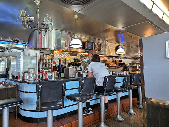 Where breakfast dreams are born and diet plans go to die. This diner counter is the front row to a culinary show.