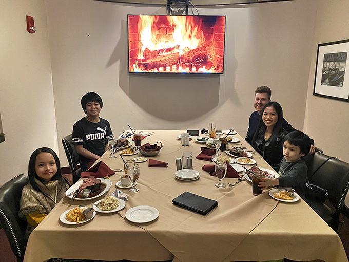 Happy diners gathered 'round the table &ndash; because nothing brings family together like the promise of prime rib.